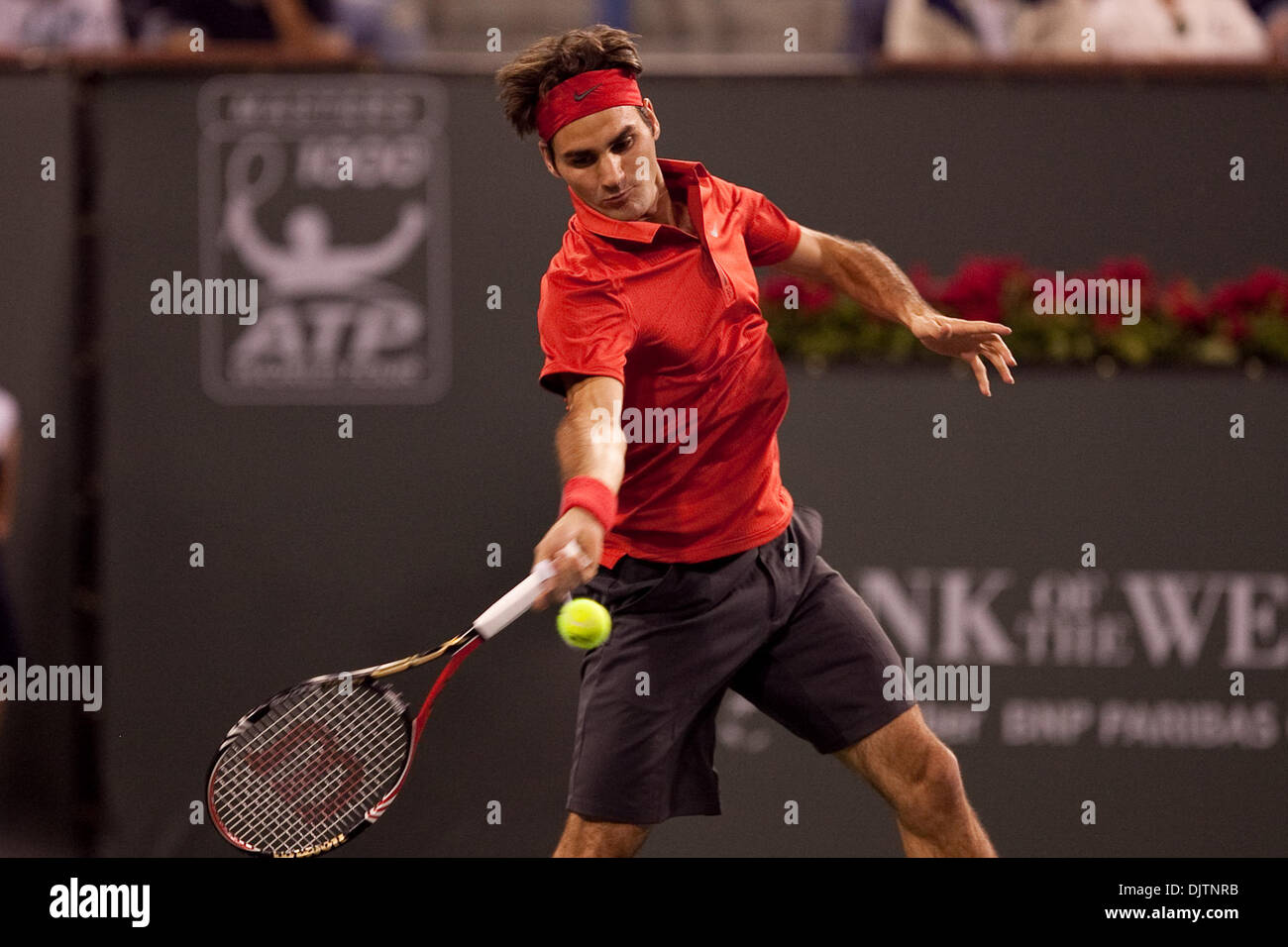 Roger FEDERER (SUI) returns a shot against Marcos BAGHDATIS (CYP) at ...