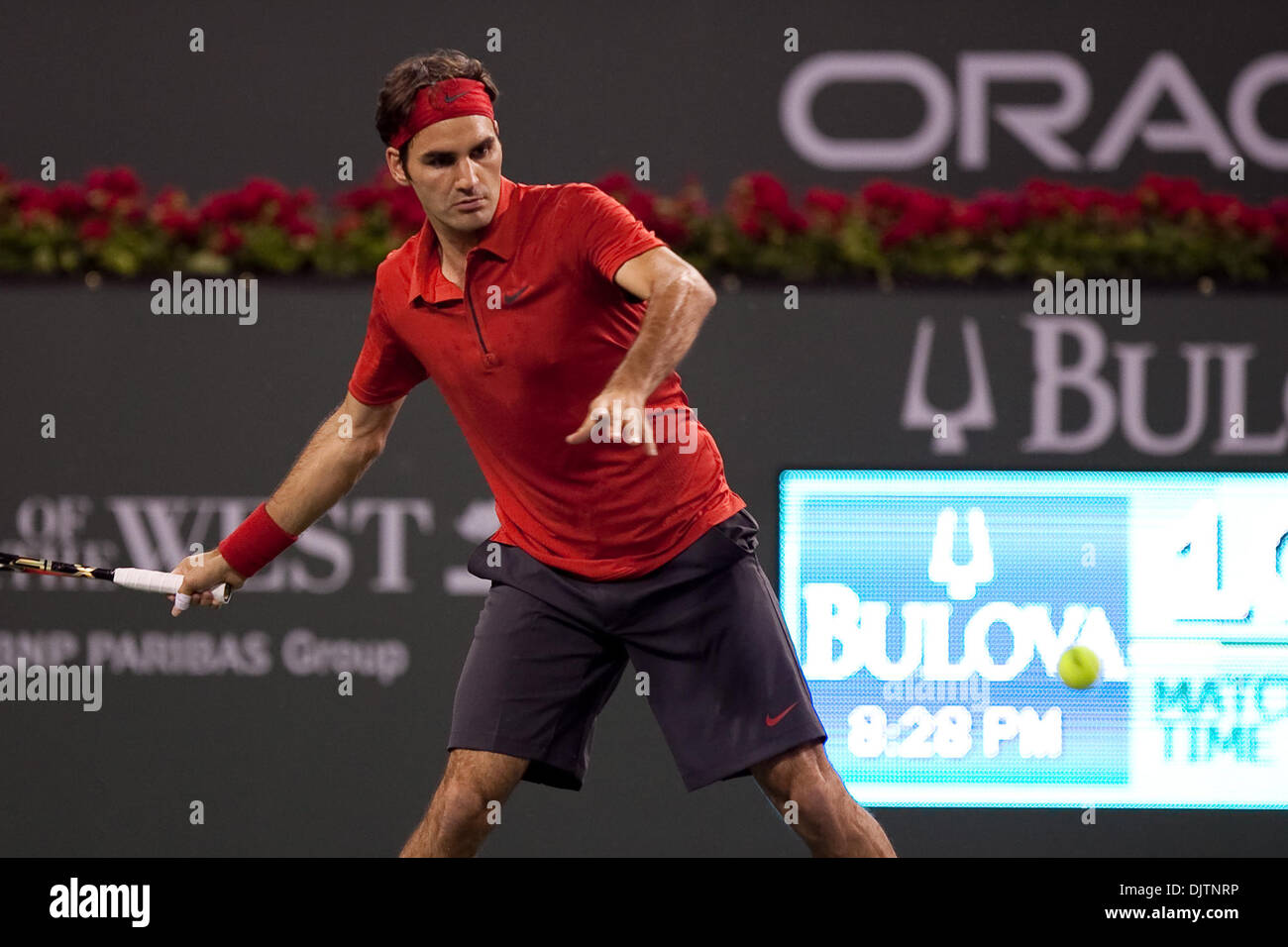 Roger FEDERER (SUI) returns a shot against Marcos BAGHDATIS (CYP) at ...