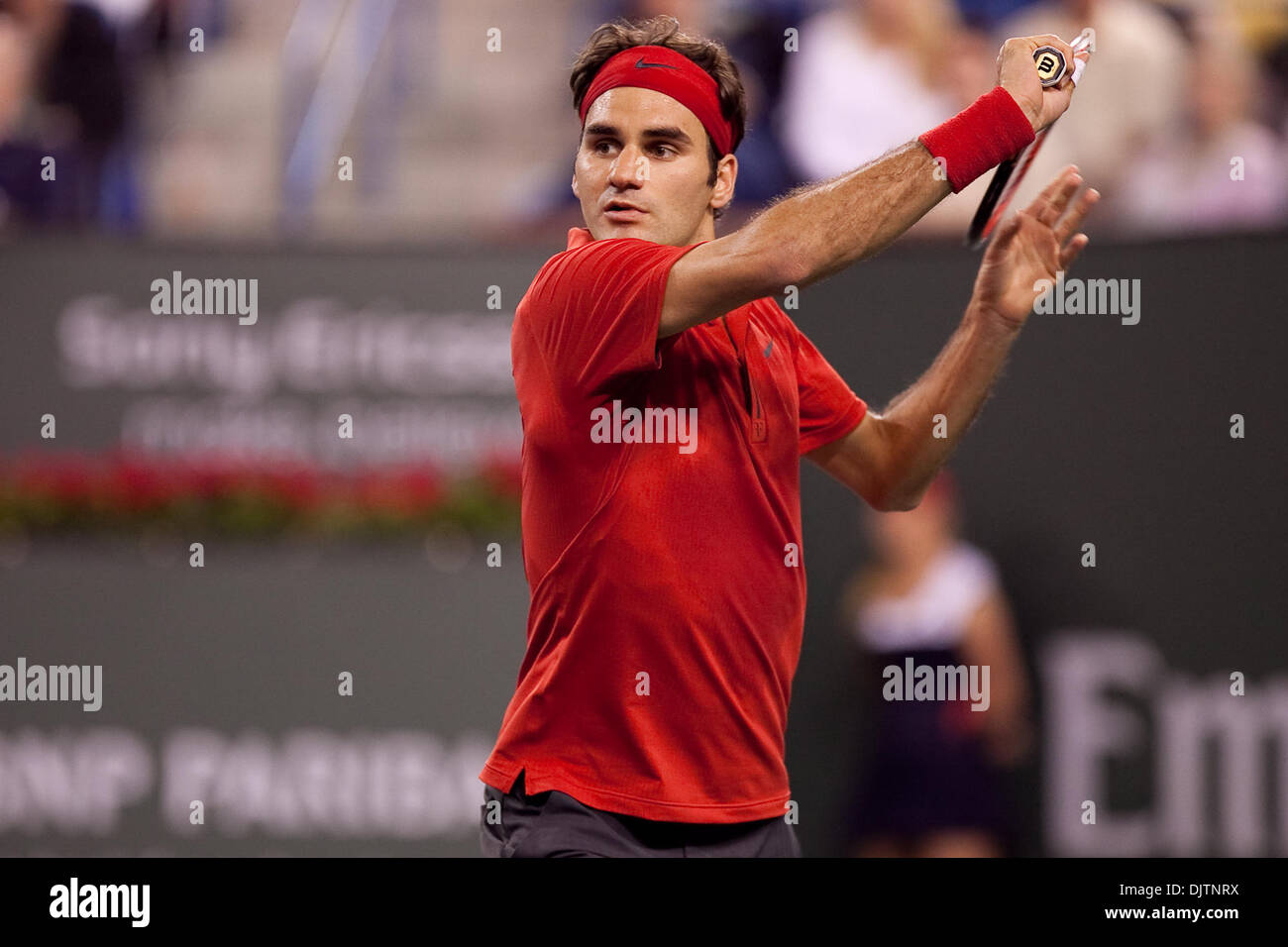Roger FEDERER (SUI) returns a shot against Marcos BAGHDATIS (CYP) at ...