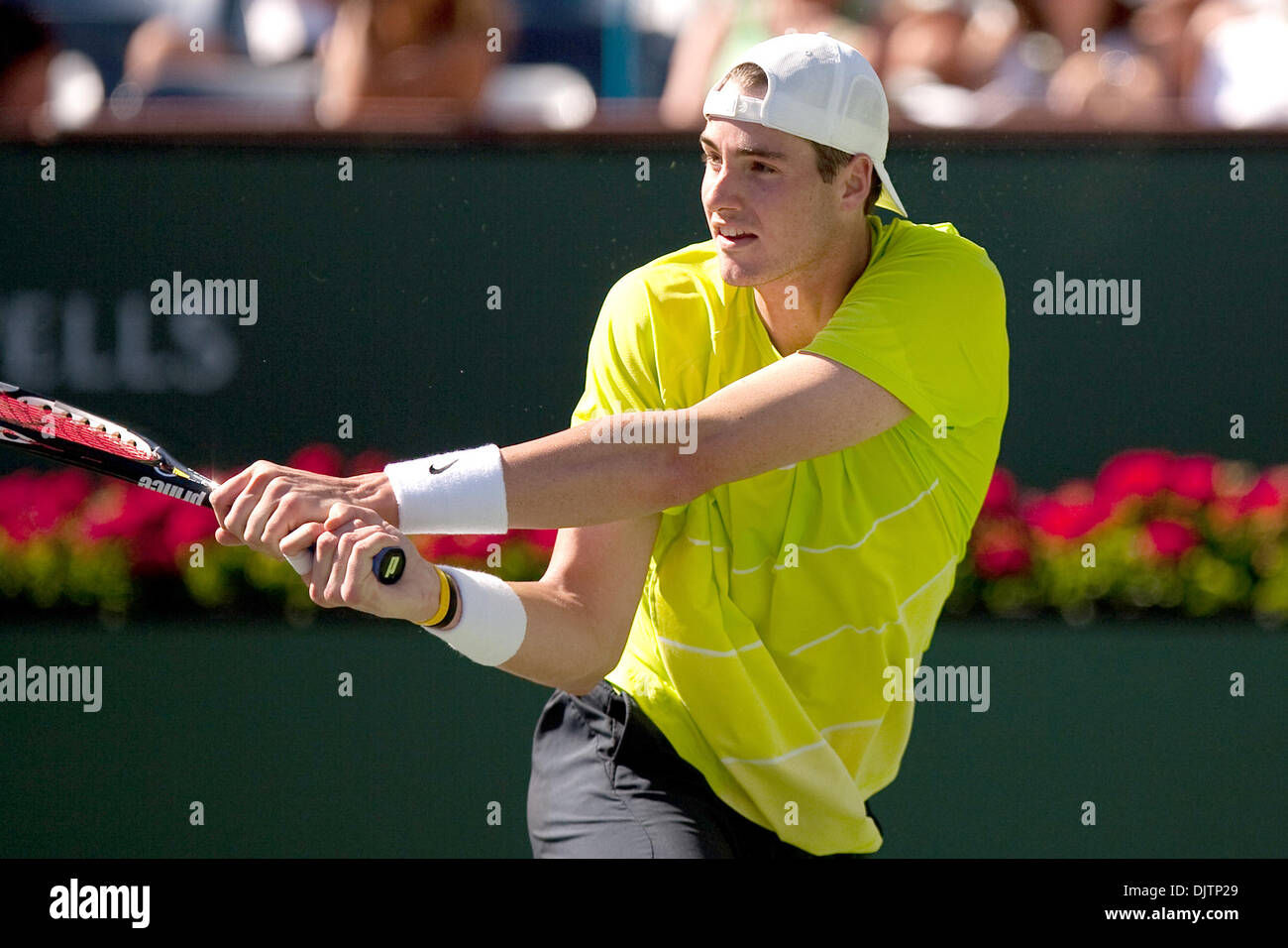 John Isner (USA) returns a shot against Rafael Nadal (ESP) at the 2010 ...