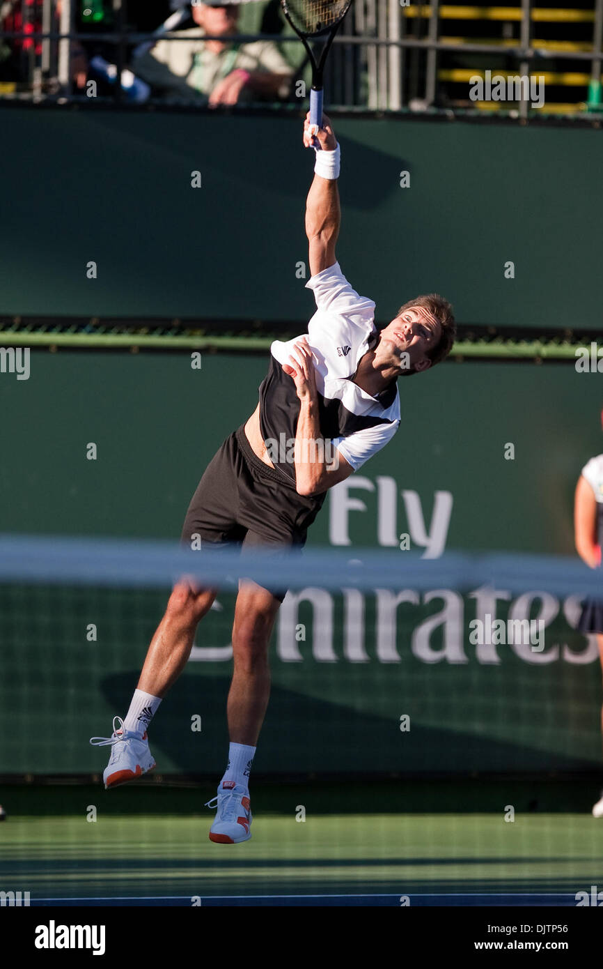 Tommy Robredo (ESP) serves against Marcos Baghdatis (CYP) at the 2010 ...