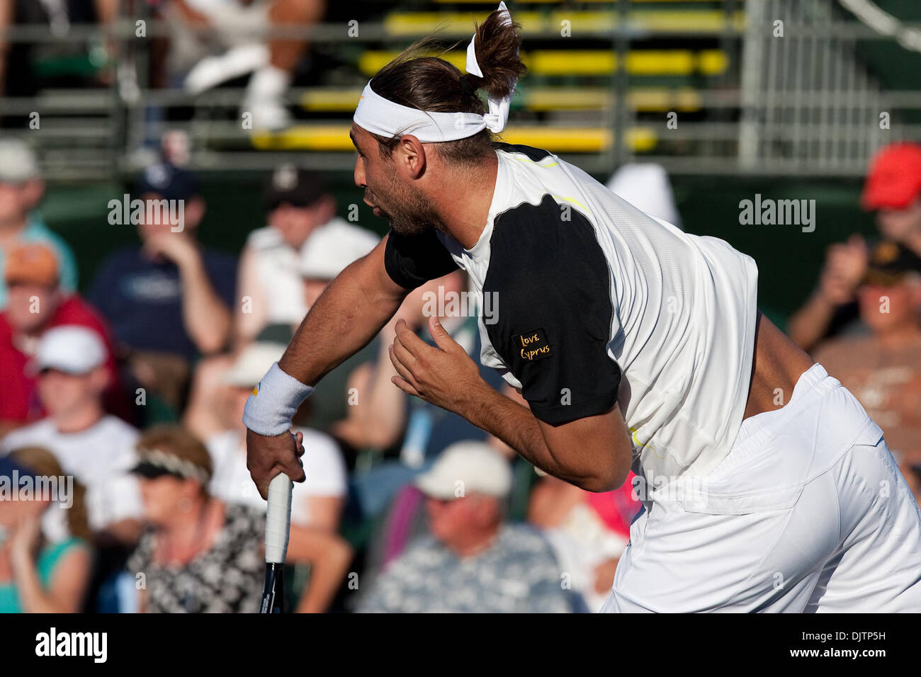 Marcos Baghdatis (CYP) serves against Tommy Robredo (ESP) at the 2010 ...