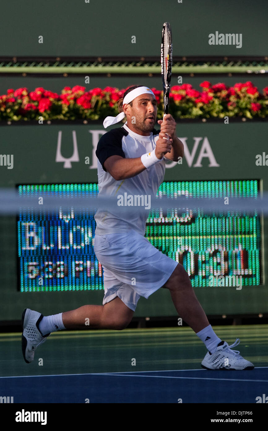 Marcos Baghdatis (CYP) returns a shot against Tommy Robredo (ESP) at ...