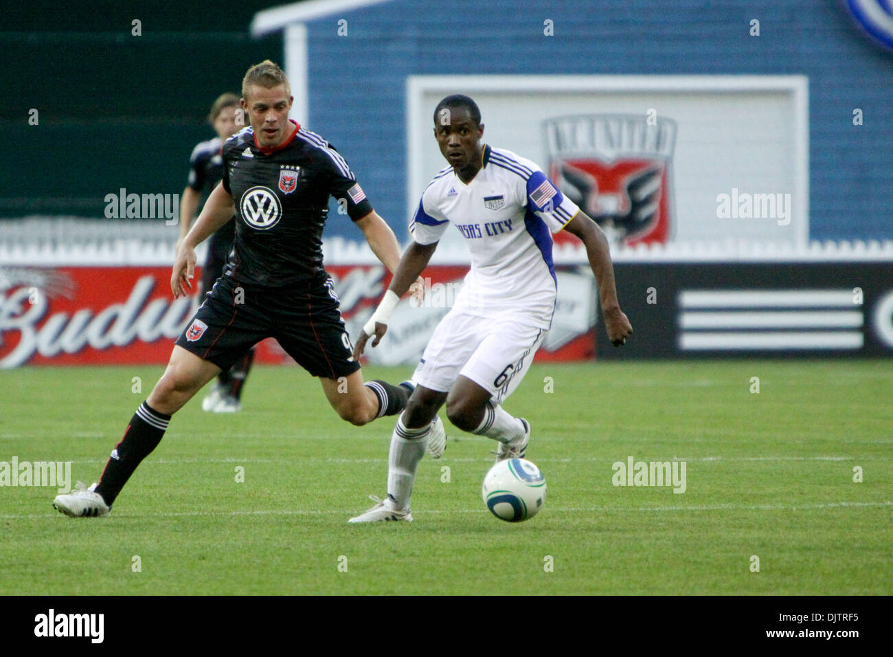 DC United forward Danny Allsopp (#9) fights for the ball against Kansas ...