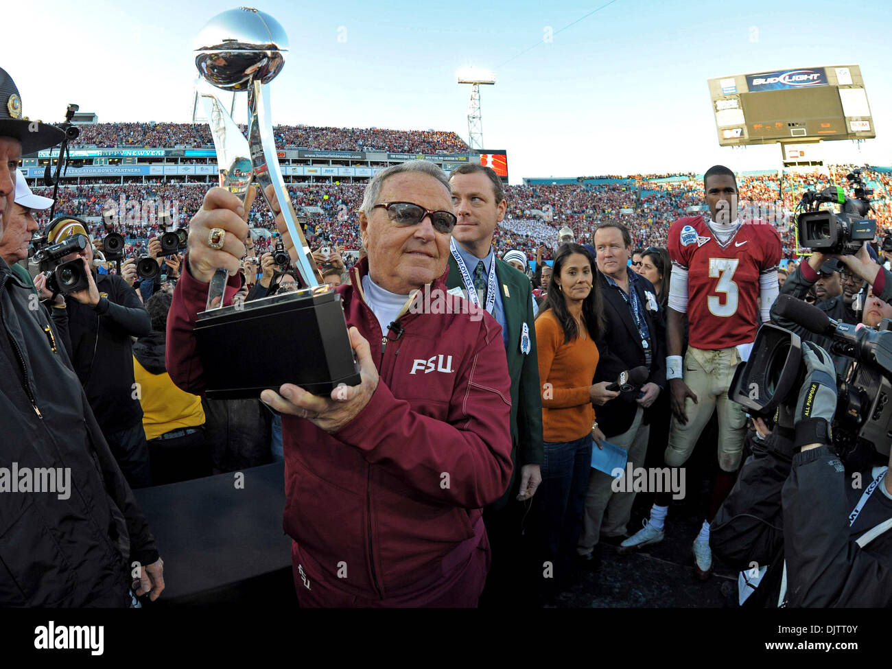 NCAA Gator Bowl - Bobby Bowden hoists the 2010 Gator Bowl trophy ...