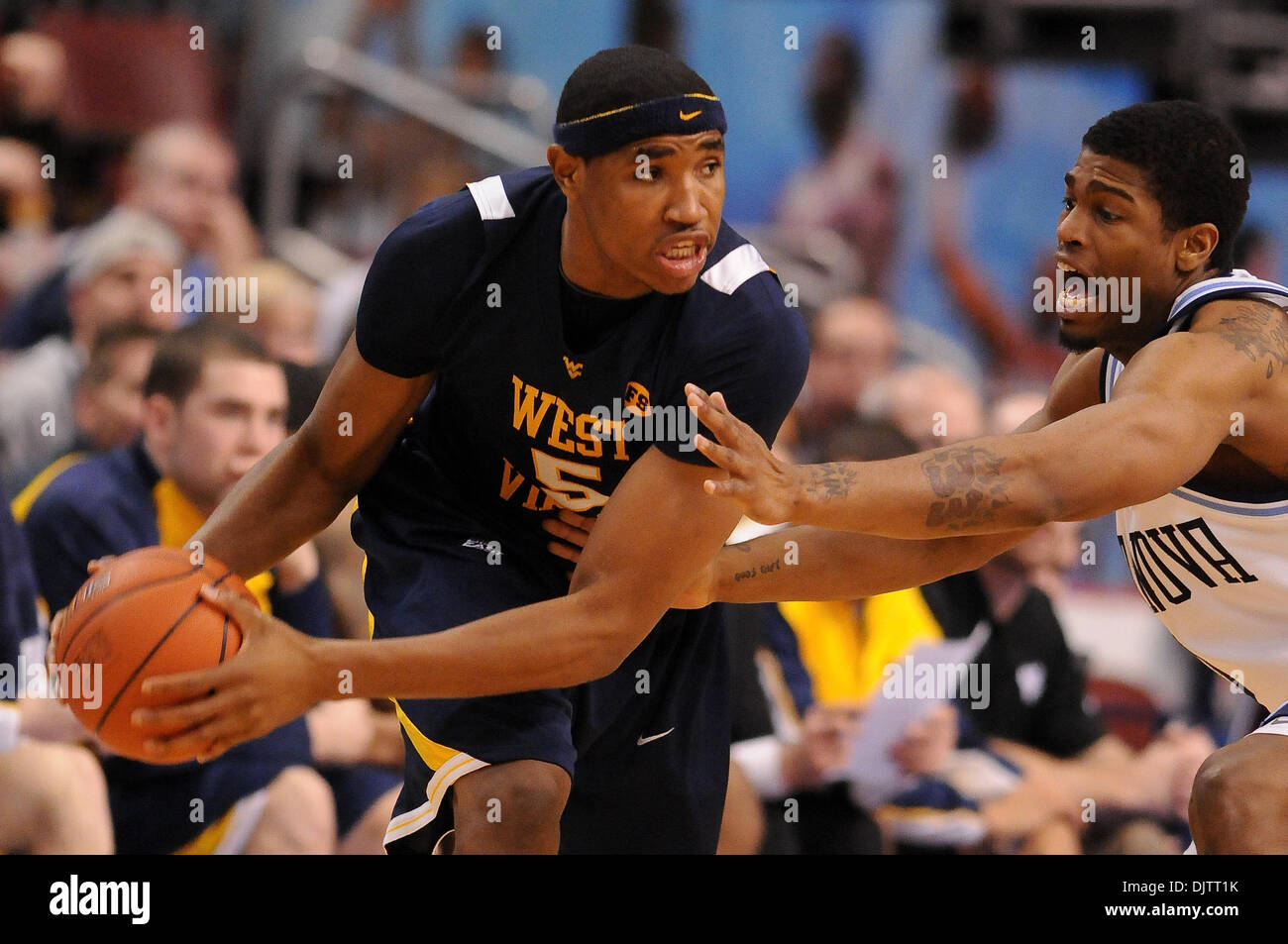 West Virginia forward Kevin Jones #5 with the ball being guarded by ...