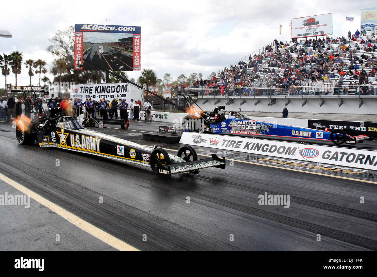 NHRA Top Fuel driver Tony Schumacher (L) beats Antron Brown (R) to win ...