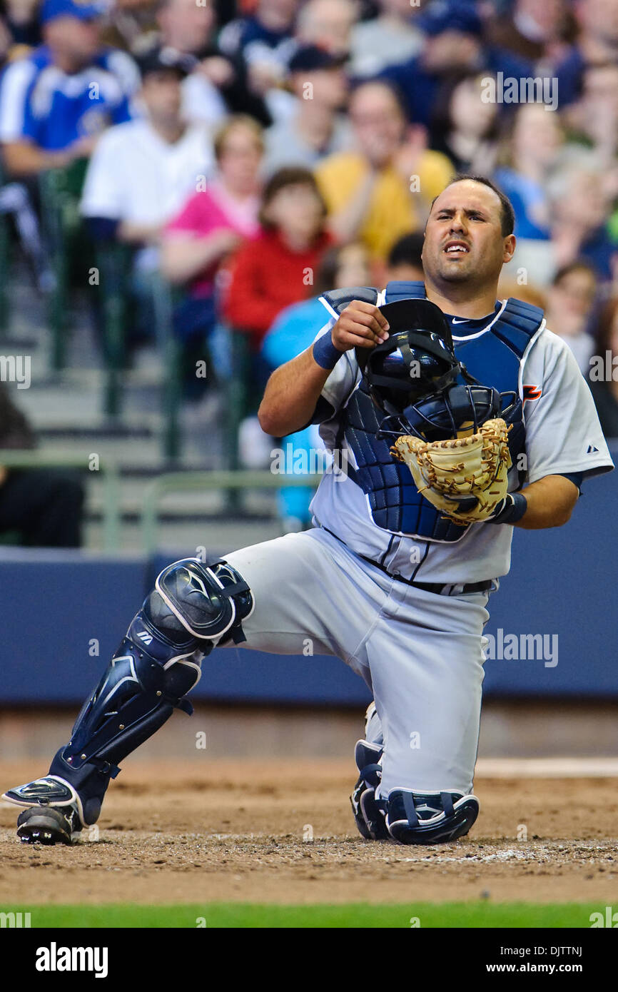 Detroit Tigers catcher Gerald Laird (8) winces after getting struck by ...
