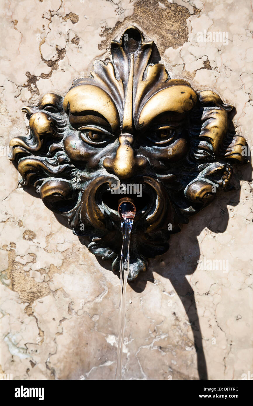 Detail of a face on a drinking fountain, Venice, Italy Stock Photo - Alamy