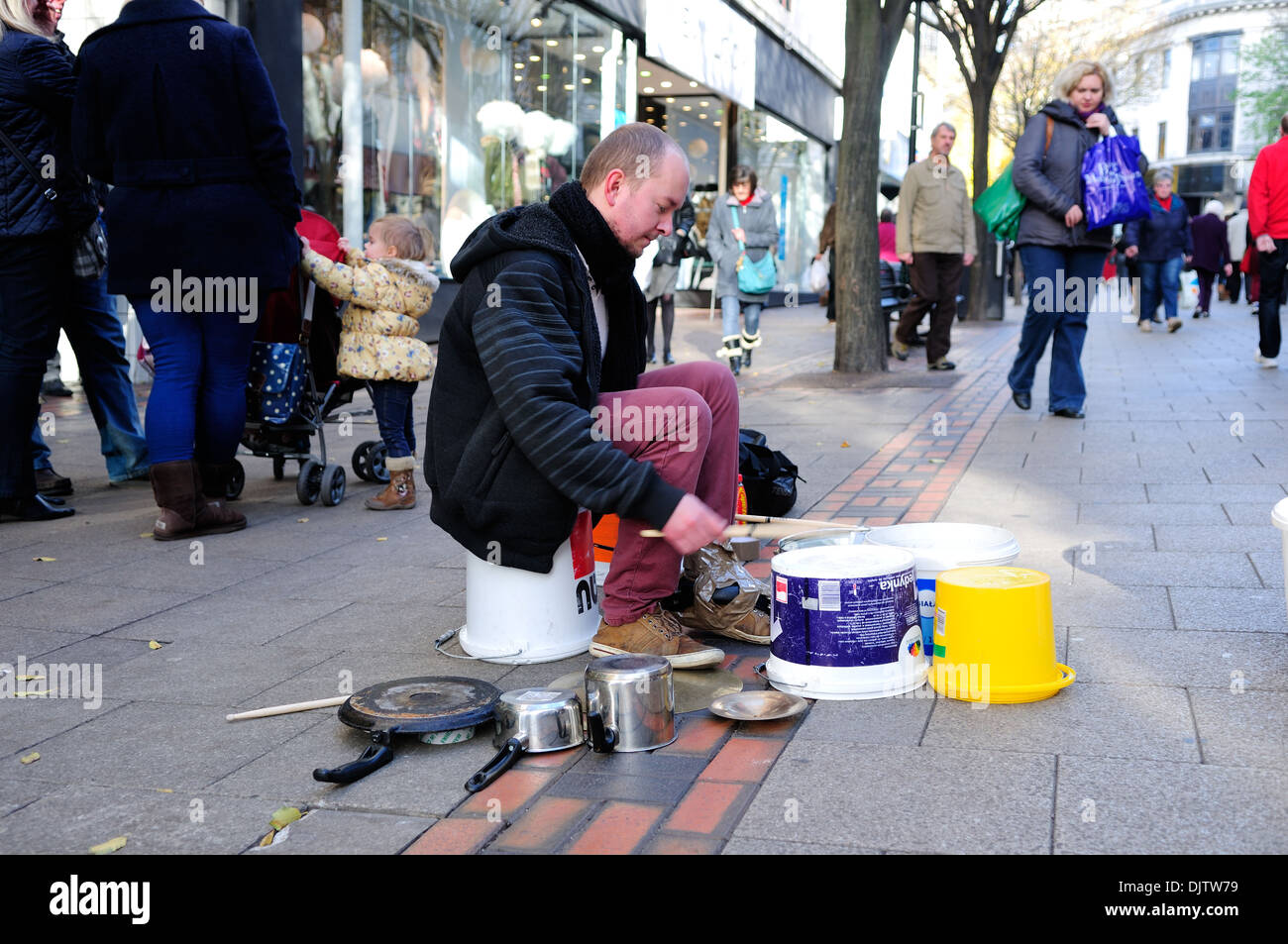 Busker Playing Home Made Drum Kit For Money Stock Photo - Alamy