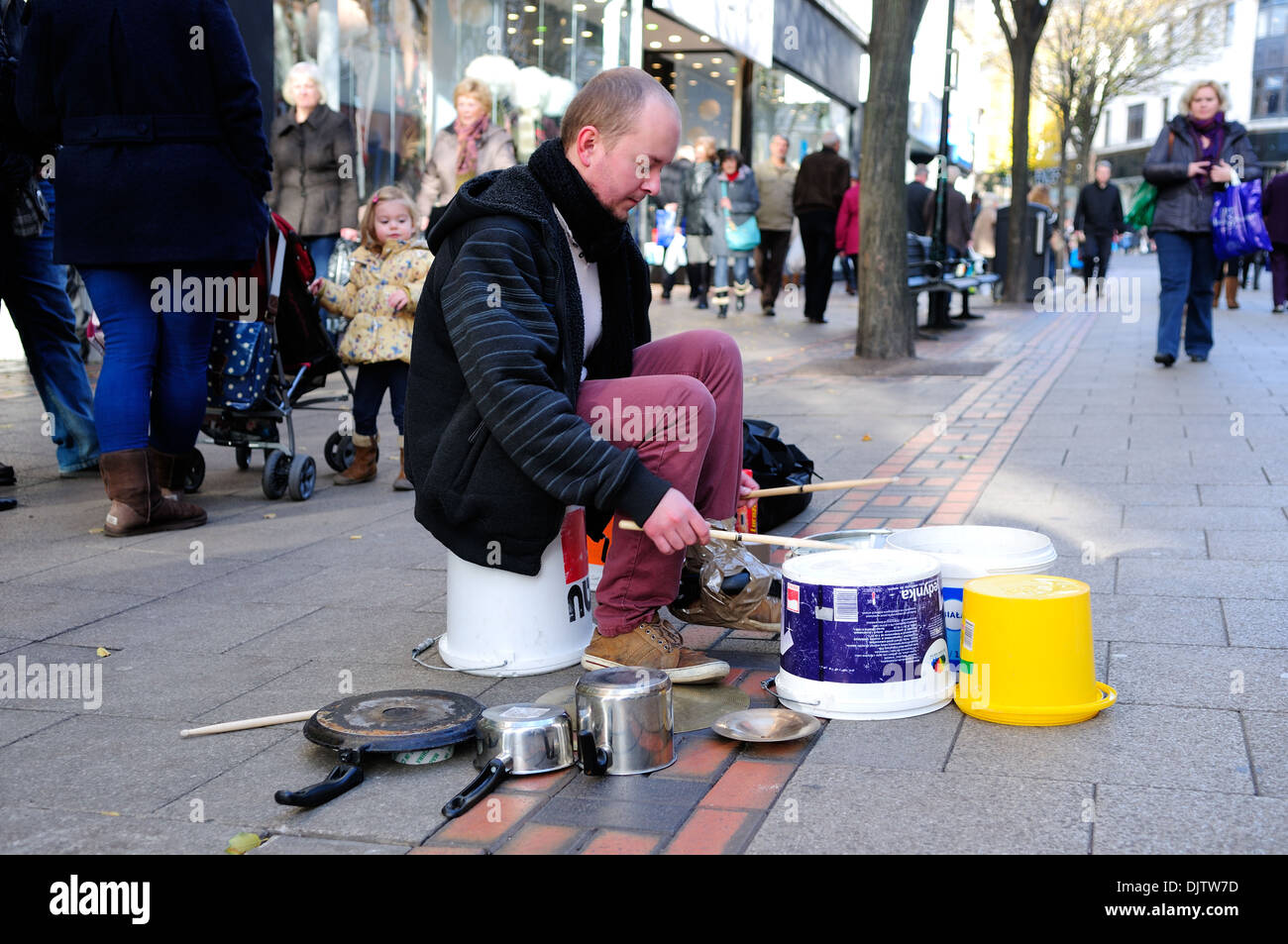 Busker Playing Home Made Drum Kit For Money Stock Photo - Alamy