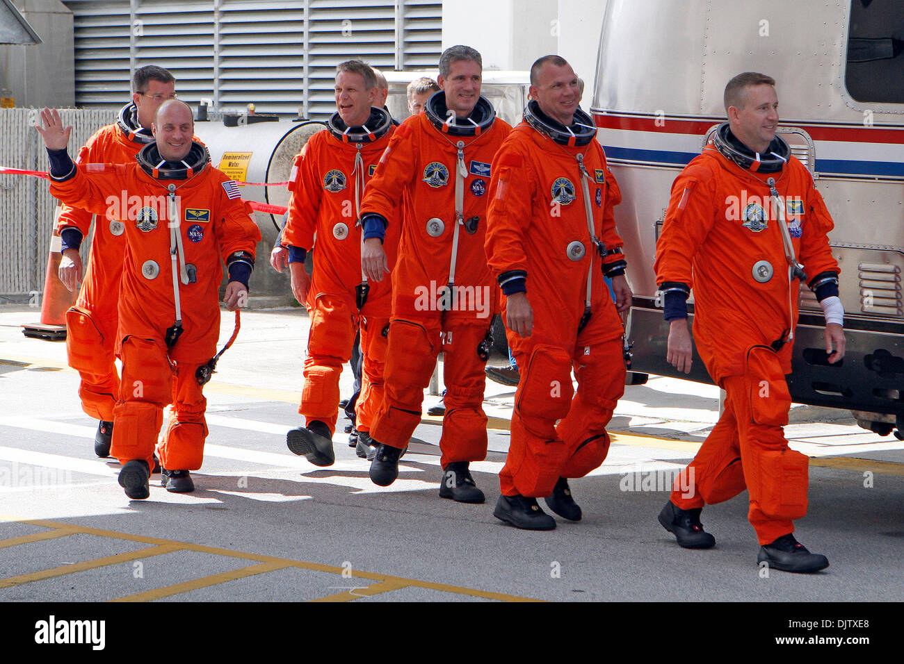 The six astronauts of space shuttle Atlantis wave to spectators as they ...