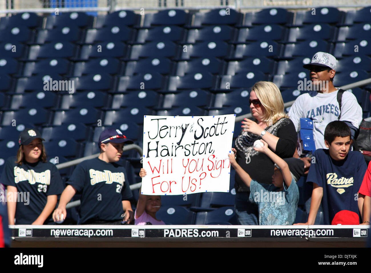 Padre fans try to lure in Scott Hairston for autographs during the ...
