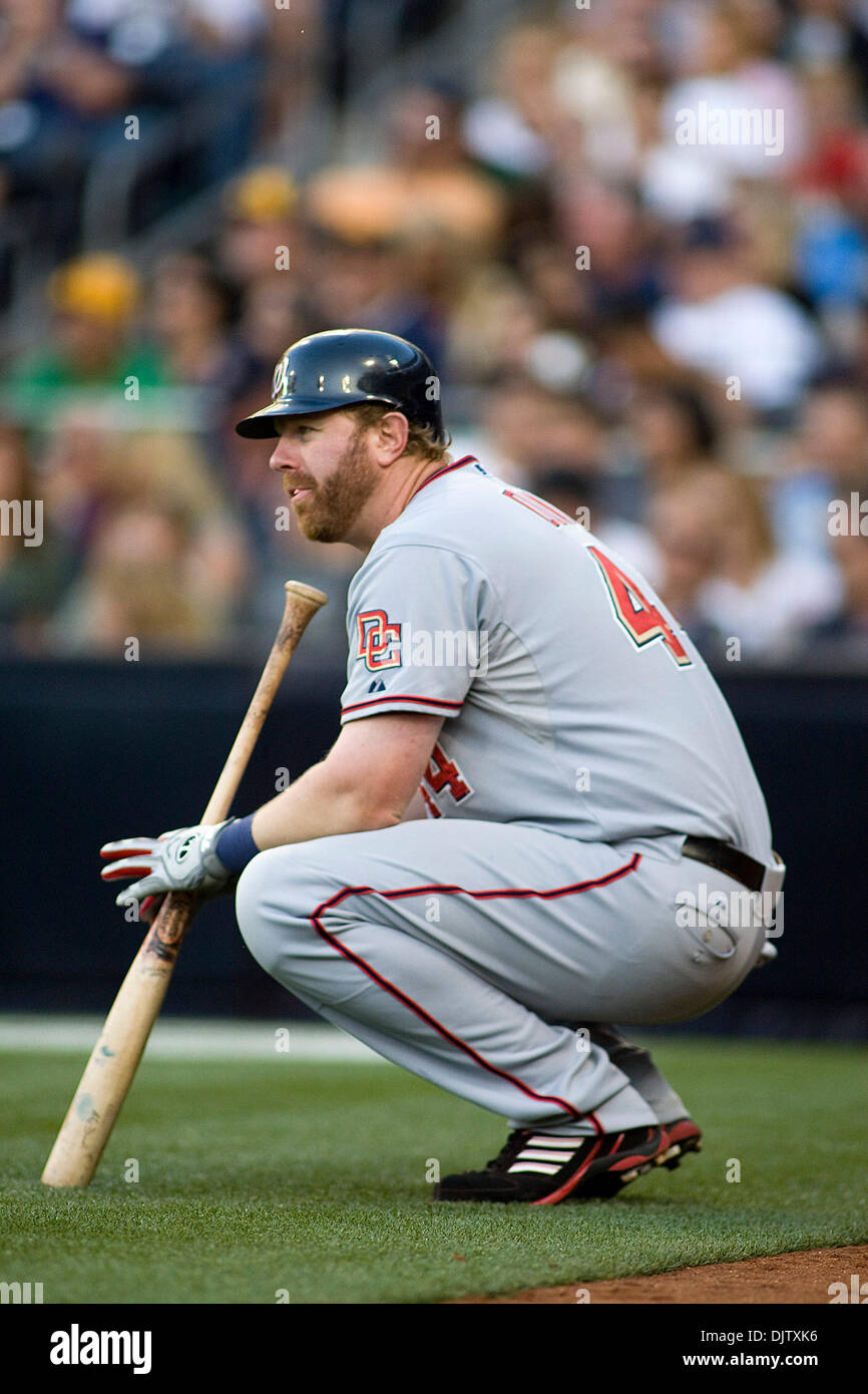 Washington Nationals Adam Dunn waits to face San Diego Padres Matt ...