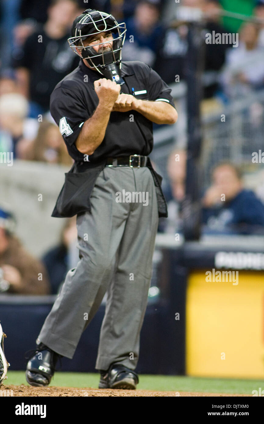 Home plate umpire Tim Tschida calls a strike for San Diego Padres Heath ...