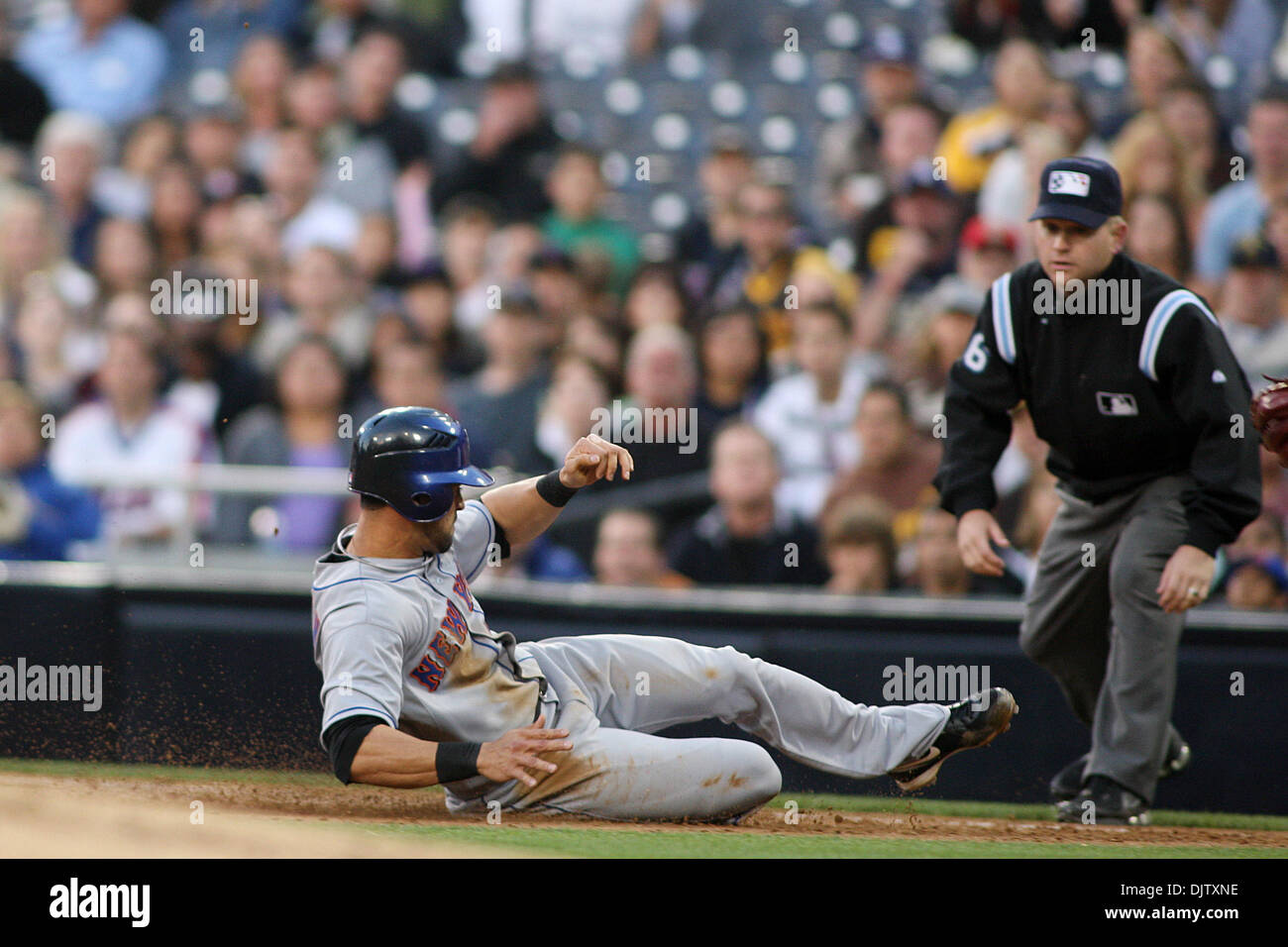 New York Mets Angel Pagan slides back to first on a fly ball out by Rod ...