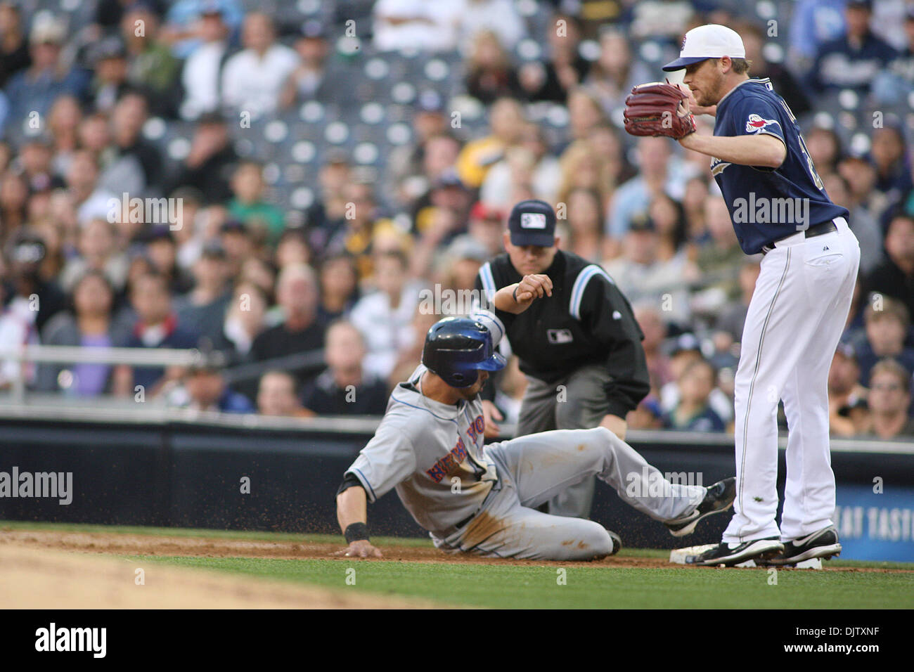 New York Mets Angel Pagan slides back to first on a fly ball out by Rod ...