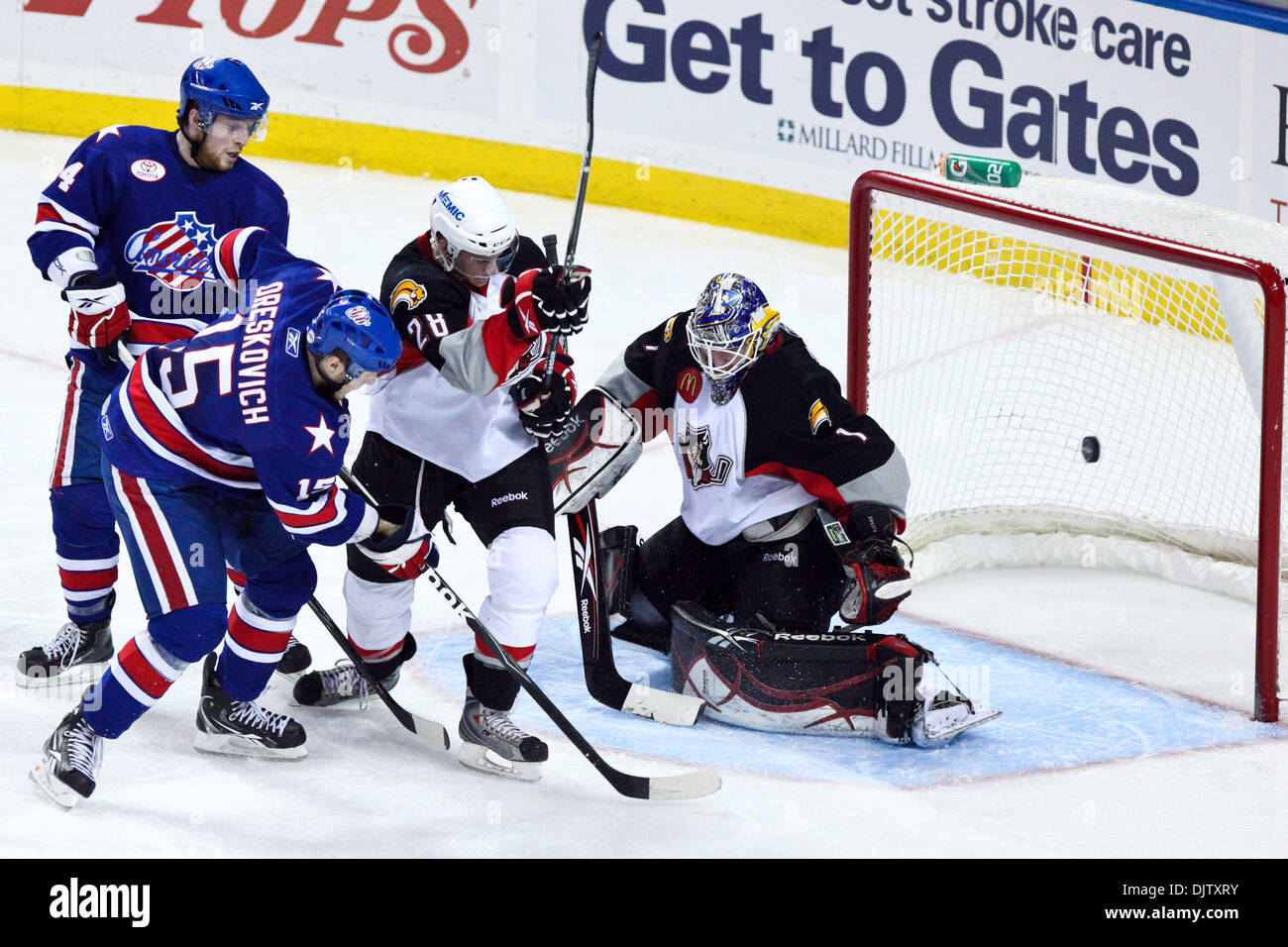 Rochester Americans Victor Oreskovich (15) puts the puck past Portland ...