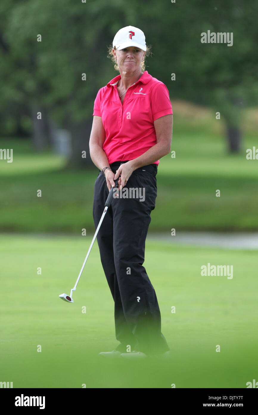 Helen Alfredsson of Sweden reacts after missing her putt on the first ...