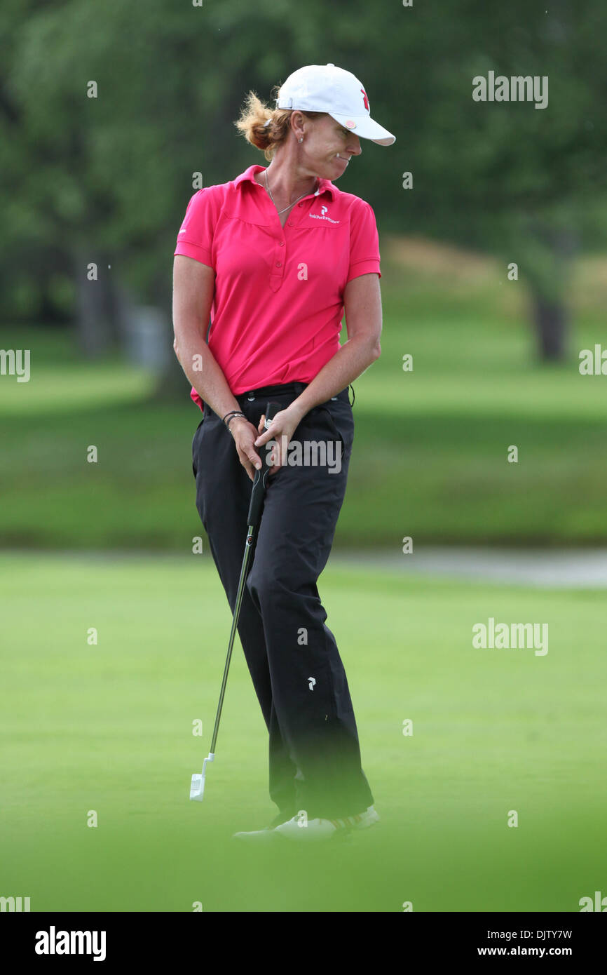 Helen Alfredsson of Sweden reacts after missing her putt on the first ...