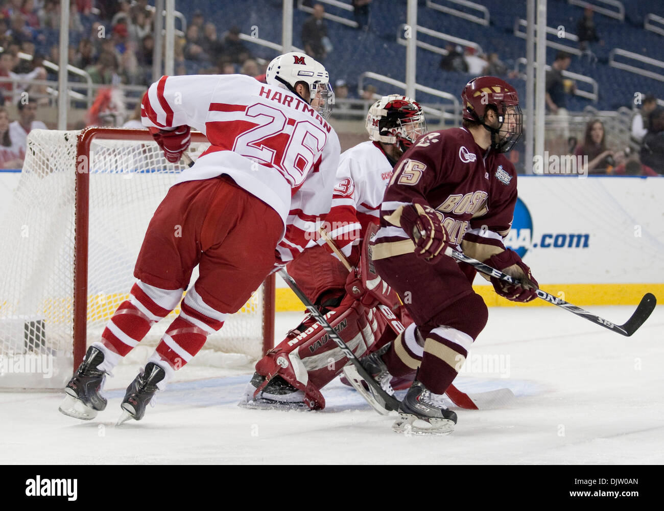 Miami Defenseman Joe Hartman (#26) defends Boston College Forward Joe ...