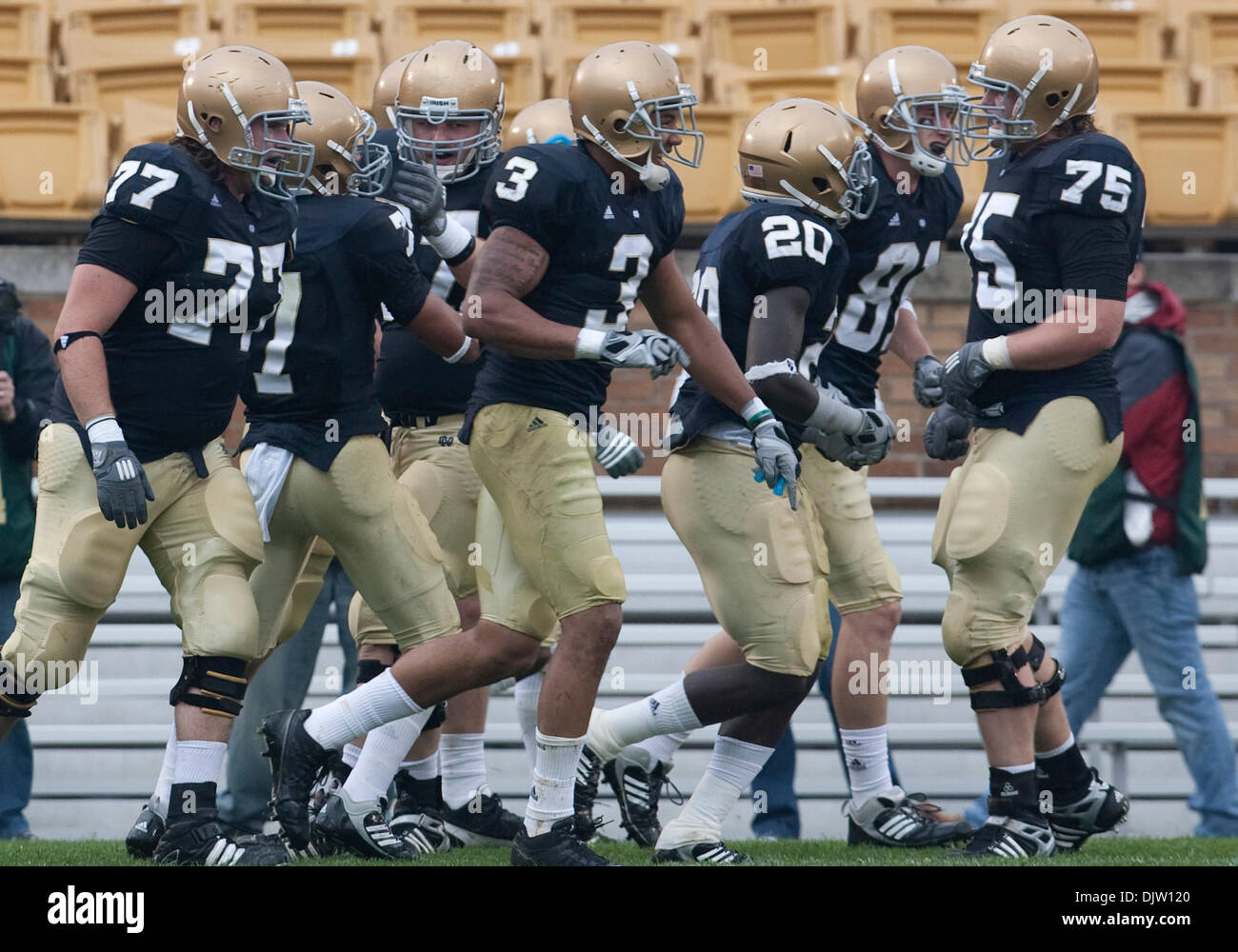 Blue team celebrates touchdown during game action in the Blue Gold ...