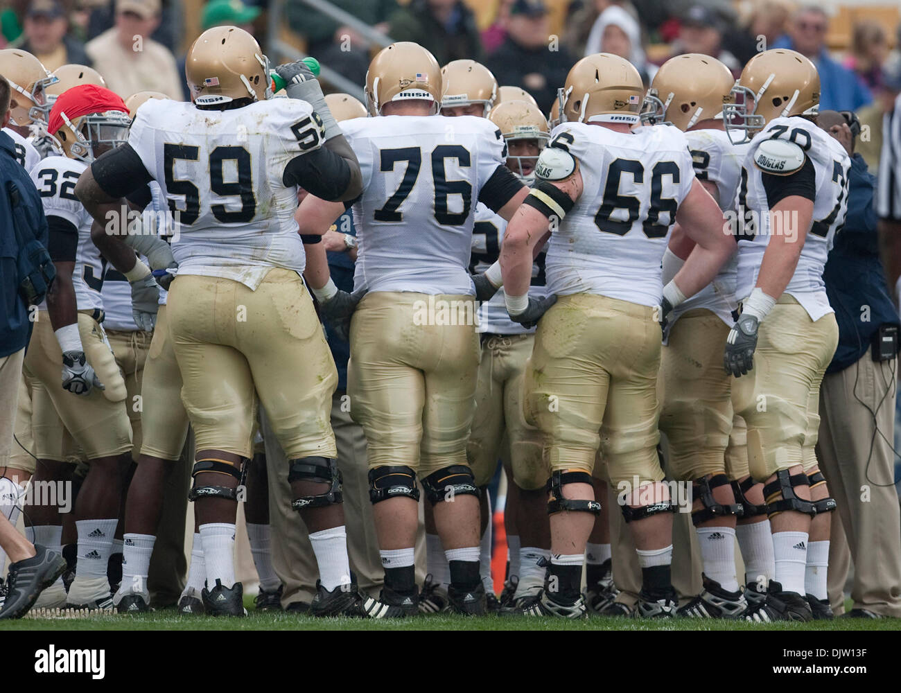 Offensive line gathers on sidelines for a break during game action in ...