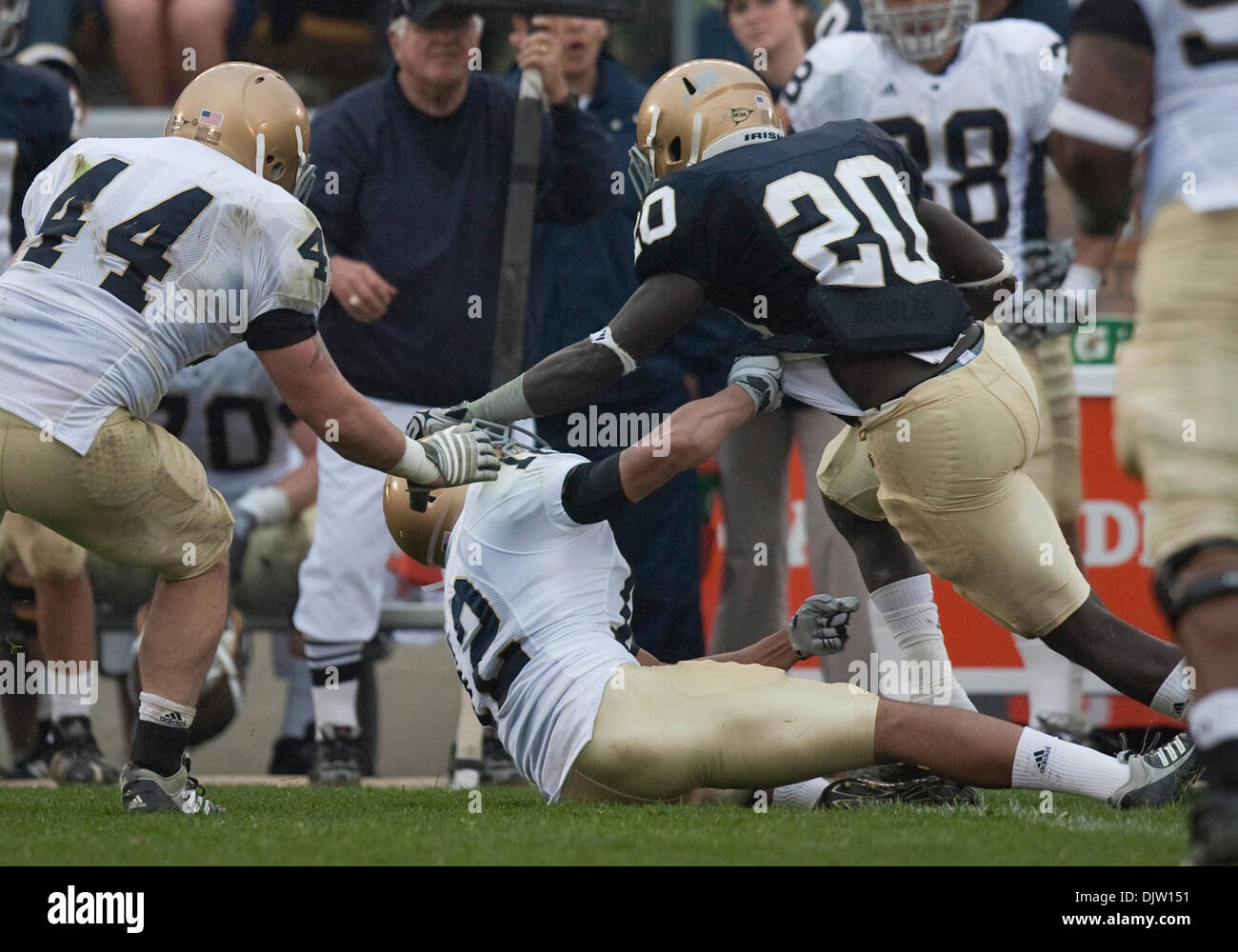 Notre Dame Tailback Cierre Wood (#20) stiff arms Cornerback Robert ...