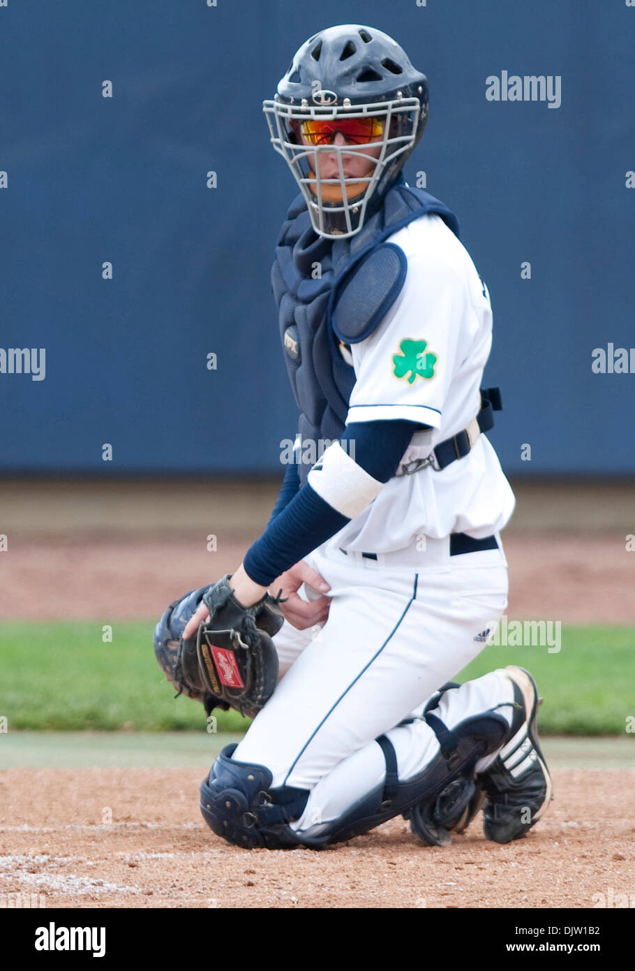 Notre Dame catcher Cameron McConnell (#28) looks to dugout for signal ...