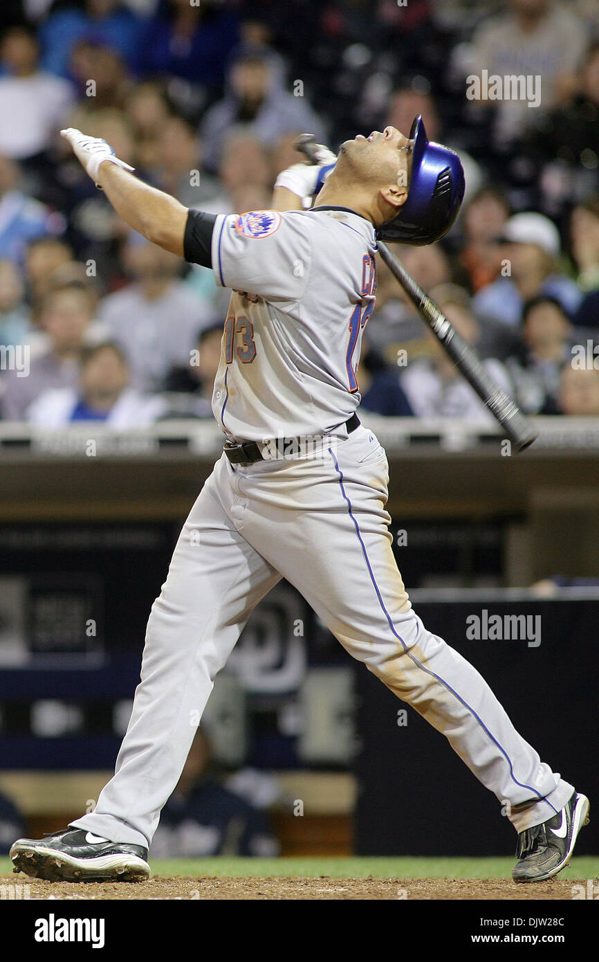 New York Mets Alex Cora watches as his ball goes foul against San Diego ...