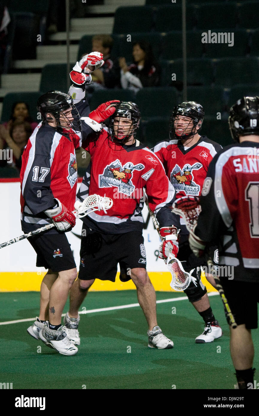 Calgary Roughnecks forwards Kaleb Toth (9) and Tracey Kelusky (17 ...