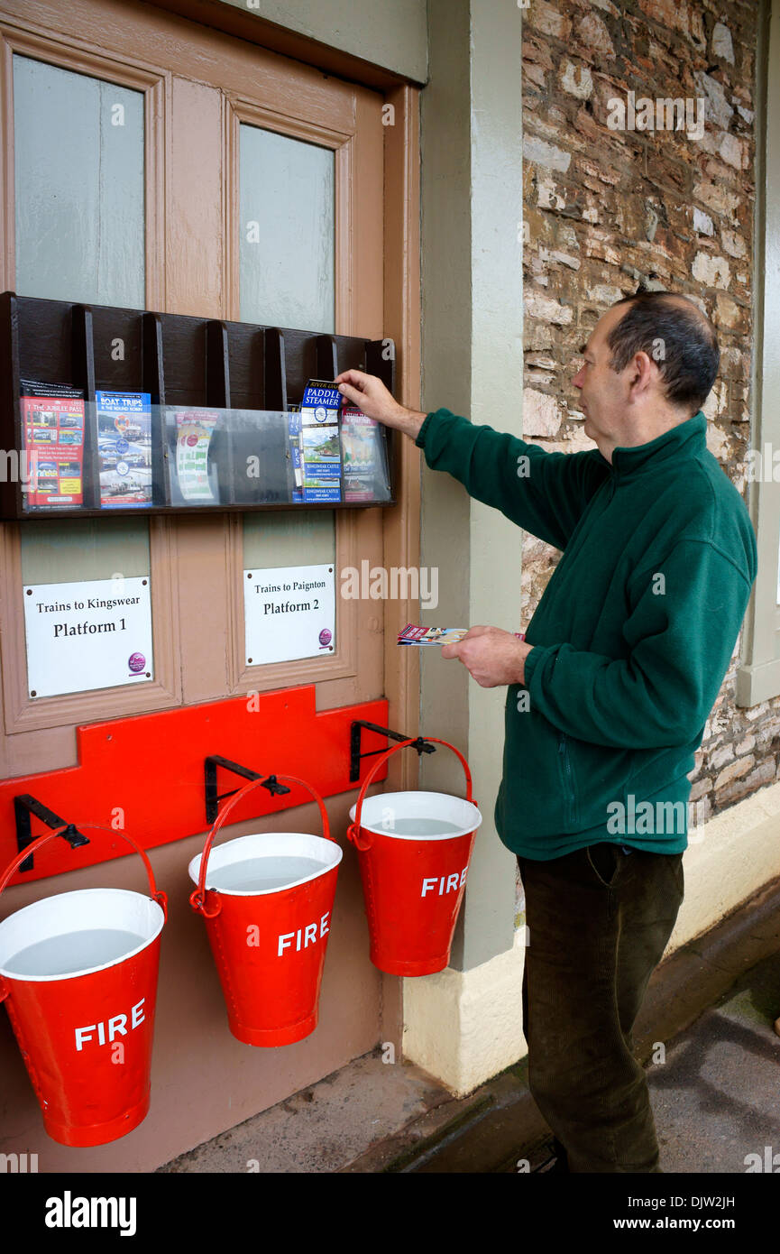 Man taking Train Timetable & Leaflets at Churston Railway Station ...