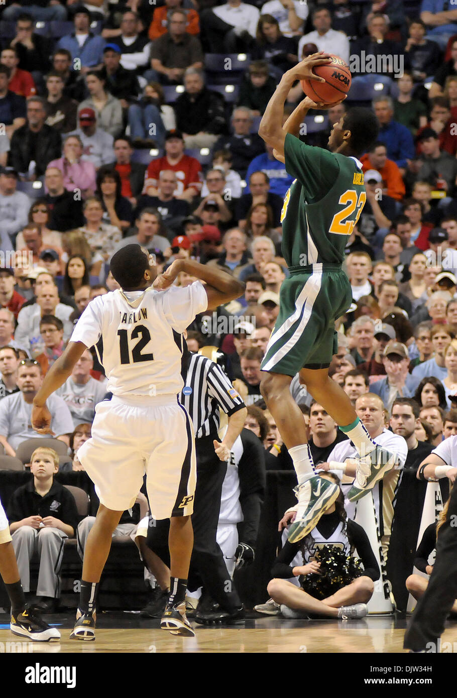 Siena's guard Edwin Ubiles pulls up for a jumper over Purdue's guard ...