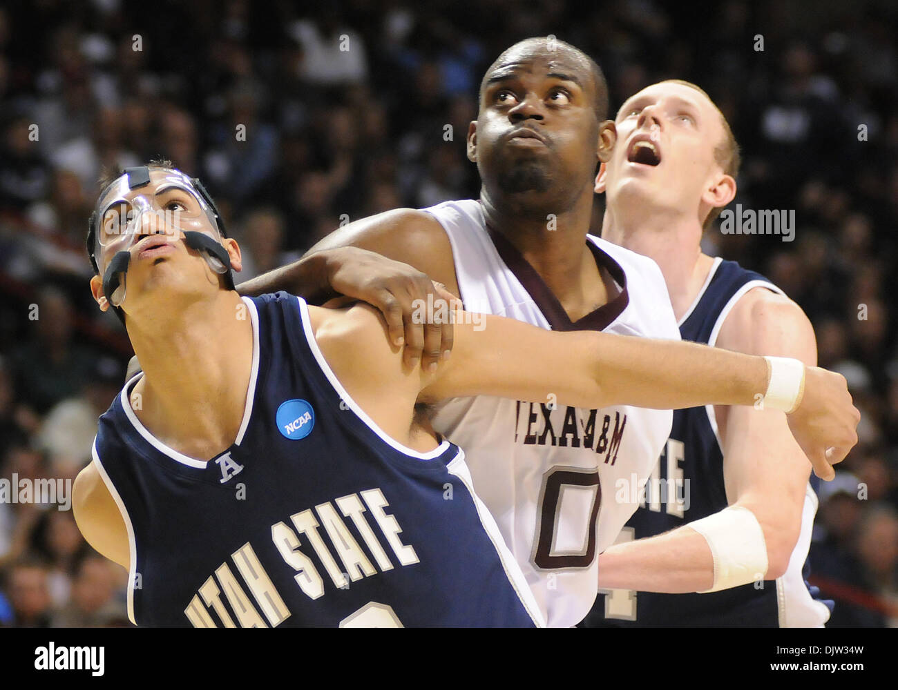 Texas A&M forward Bryan Davis (0) fights for position with Utah State's ...