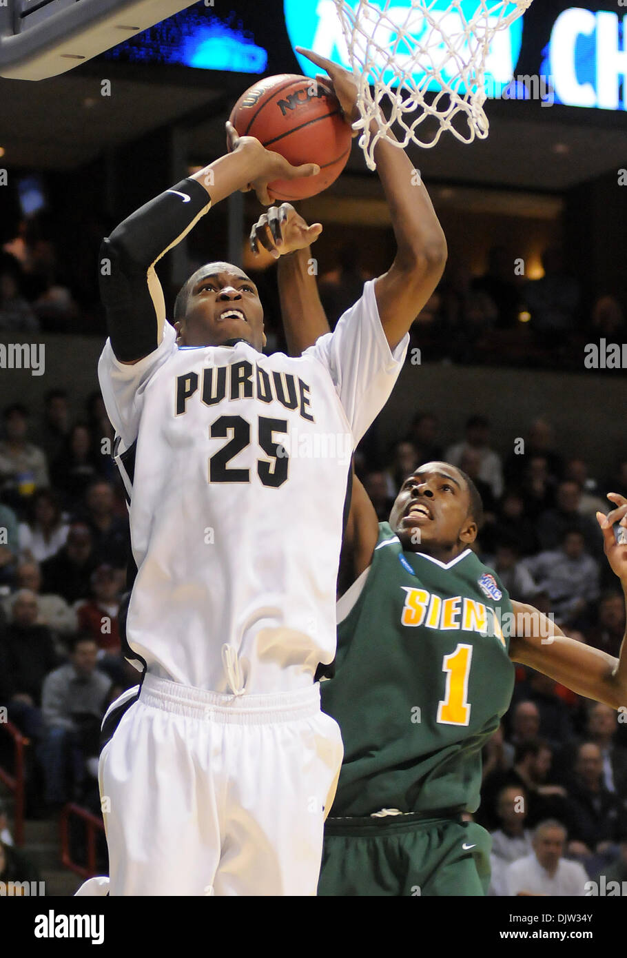 Purdue's forward JaJuan Johnson (25) goes up for a basket past Siena's ...