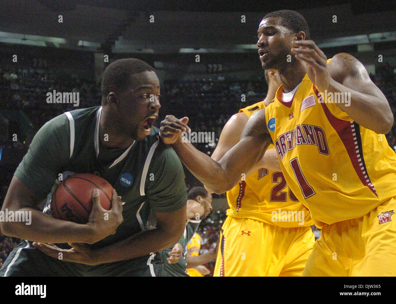 Michigan State's forward Draymond Green, left, pulls down the rebound ...