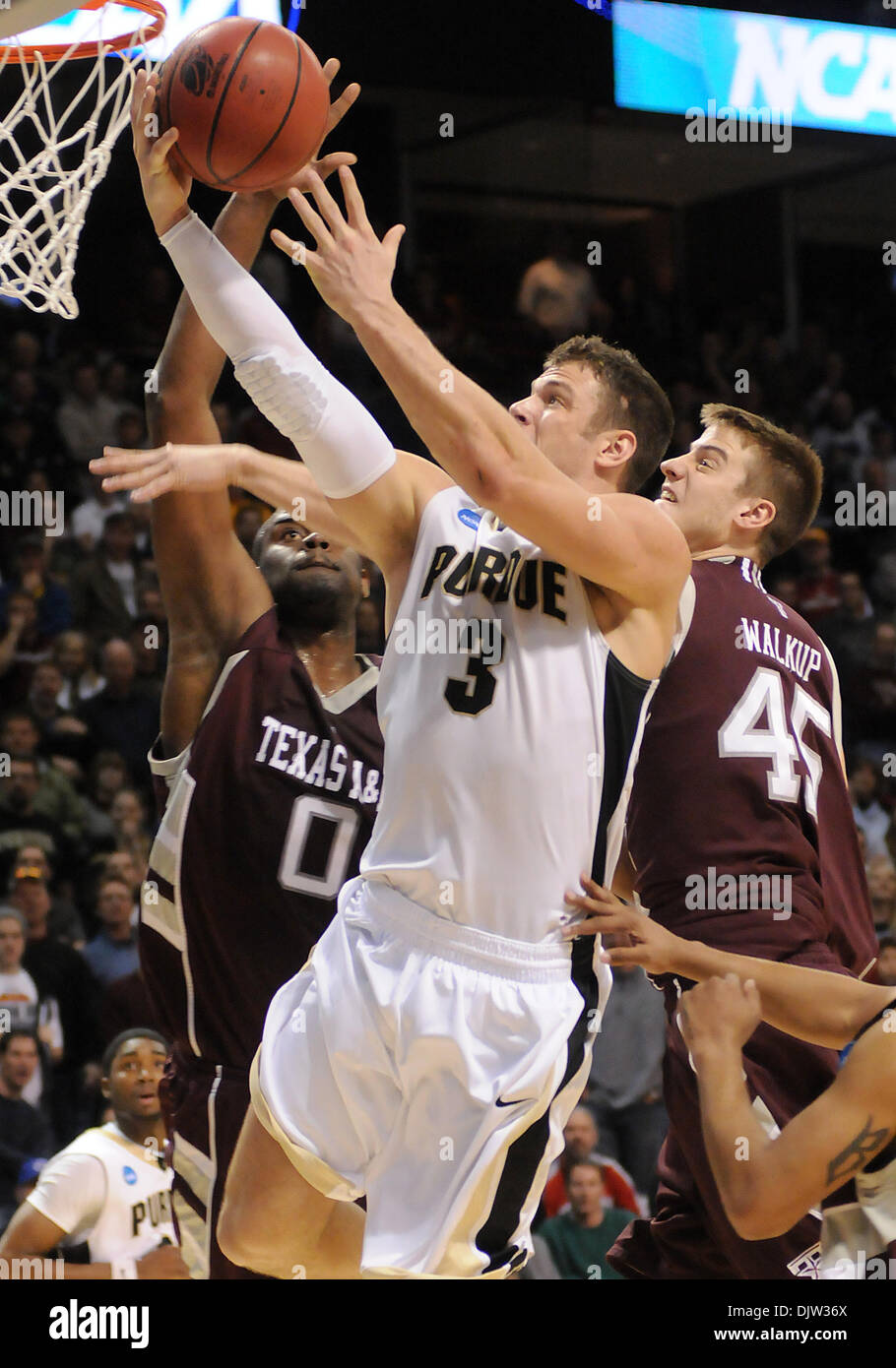 Purdue's guard Chris Kramer (3) gets by Texas A&M's forward Bryan Davis ...