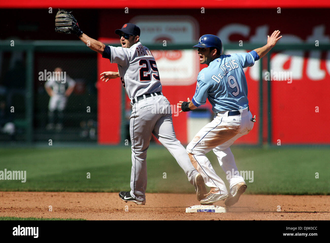 Detroit Tigers left fielder Ryan Raburn (25) and Kansas City Royals ...