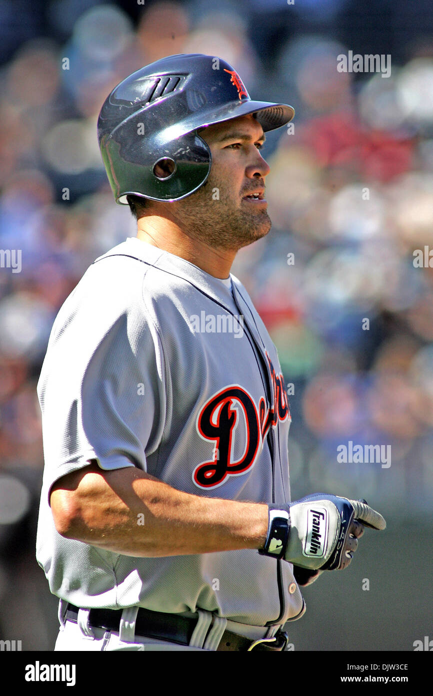 Detroit Tigers left fielder Johnny Damon (18) walks to pick up his ...