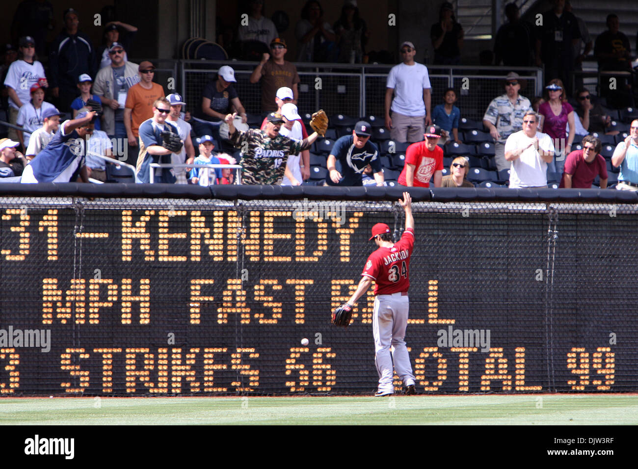 Arizona Diamondbacks left fielder Conor Jackson calls for a ground rule ...