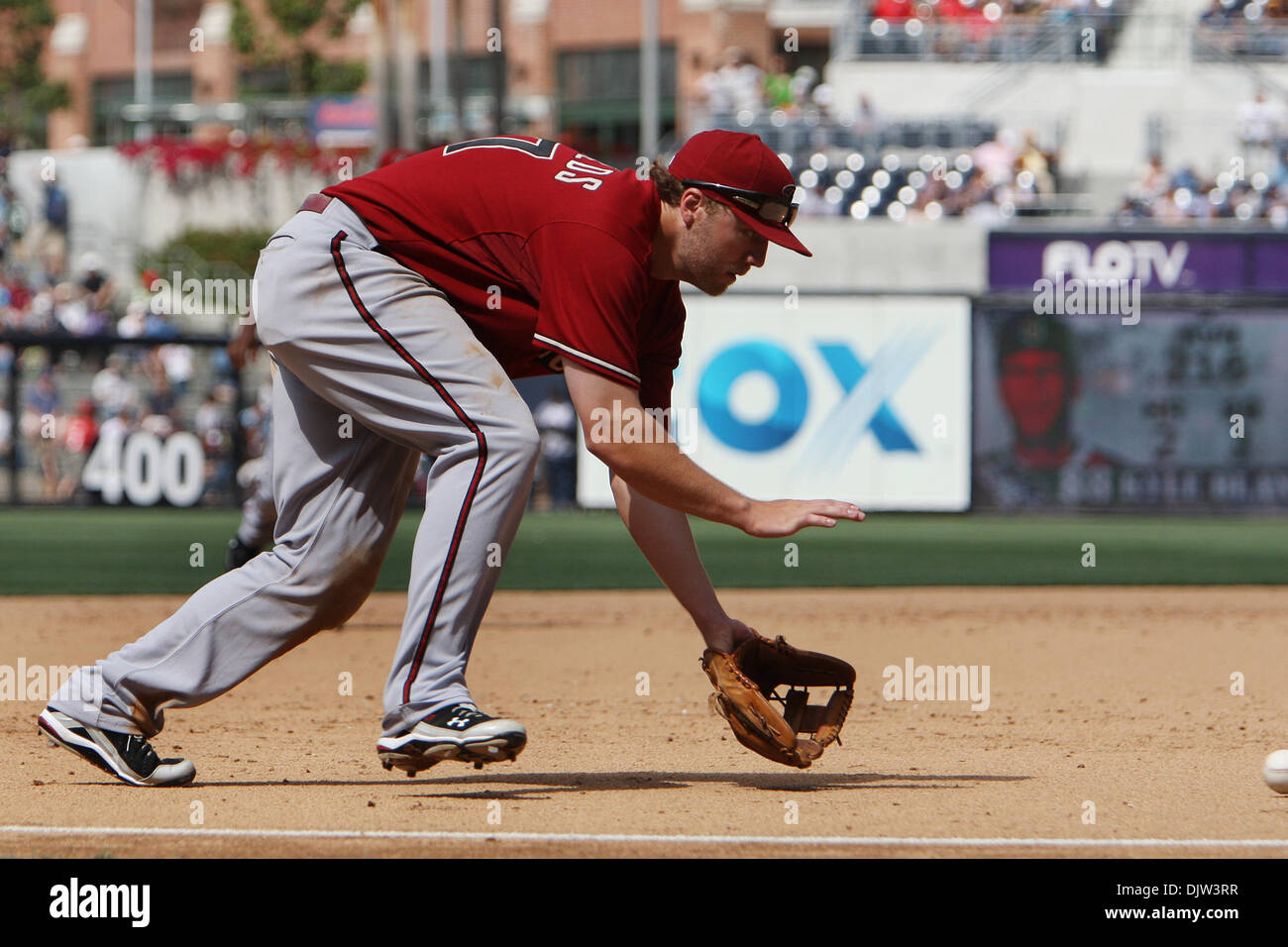 Arizona Diamondbacks third baseman Mark Reynolds fields a ground ball ...