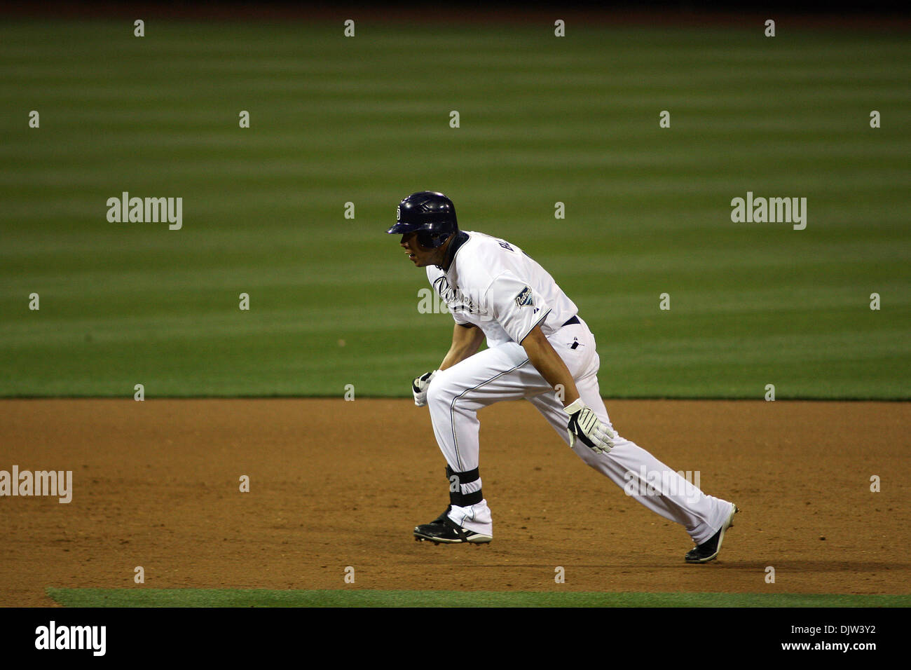 San Diego Padres Kyle Blanks dives for third on a triple against San ...