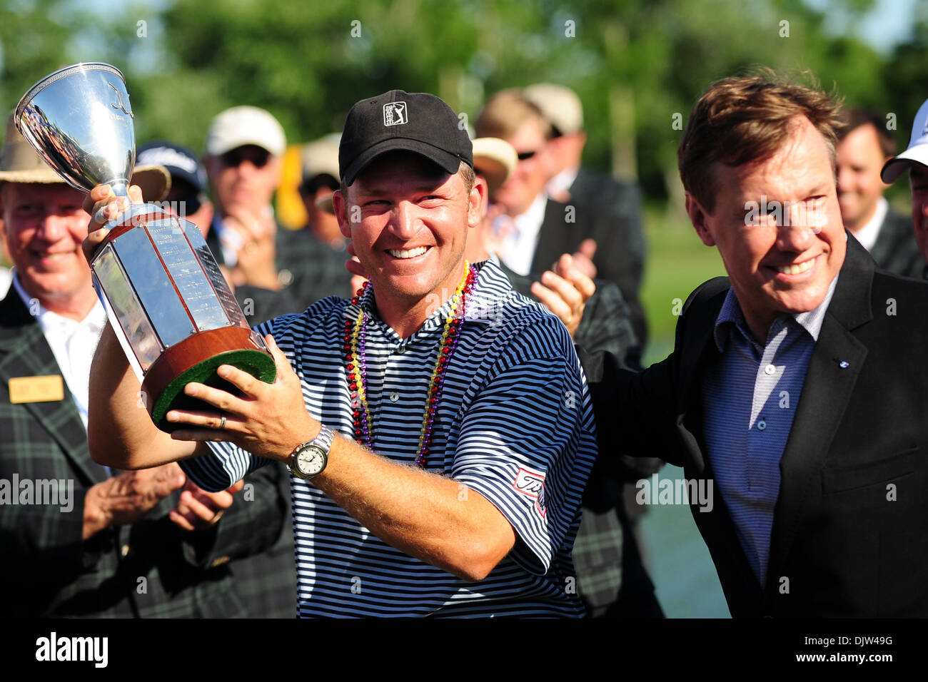 Jason Bohn holds the Champions Trophy following the final round of the ...