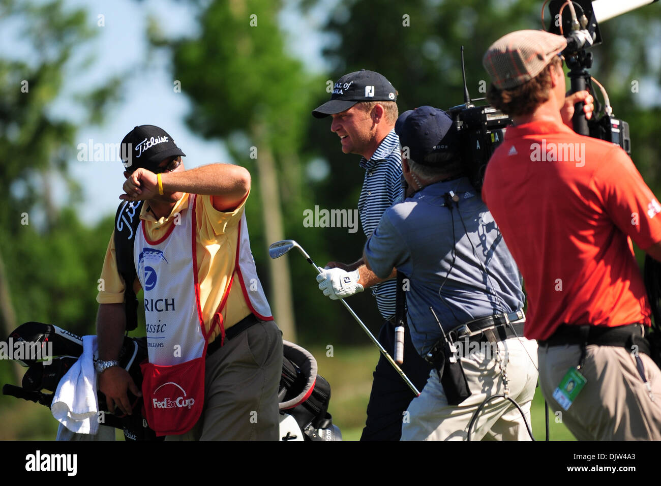 Jason Bohn is surrounded by media as he approaches the 72nd green ...