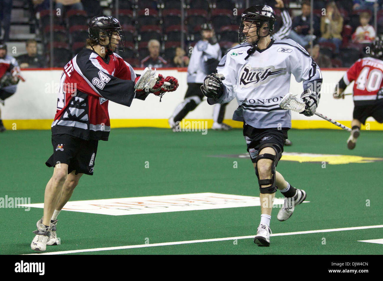 Calgary Roughnecks Defenceman Scott Carnegie (24) blocks Edmonton Rush ...