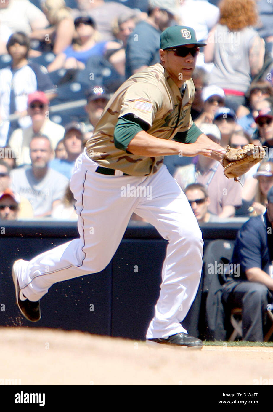 San Diego Padres first baseman Kyle Blanks makes a play against the ...