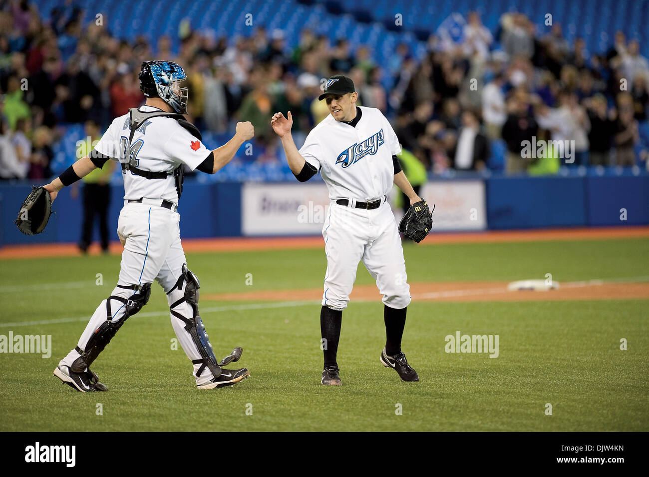 Toronto Blue Jays catcher John Buck #14 and pitcher Shawn Camp #57 at ...