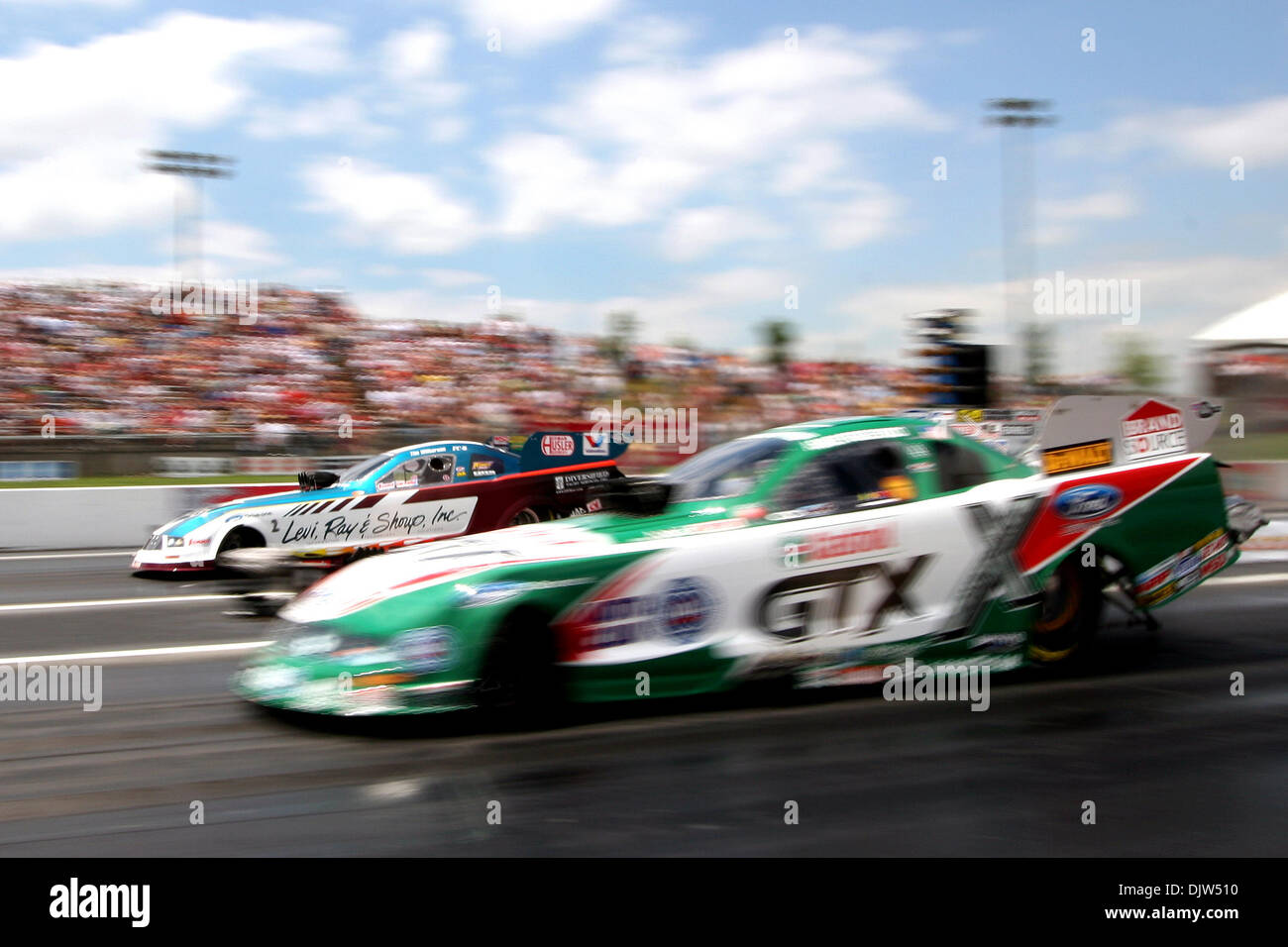Tim Wilkerson and Ashley Force Hood jump off the line during the second ...