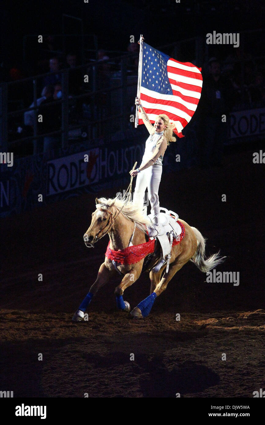 March 2 2010: A rider carries the American Flag during the National ...