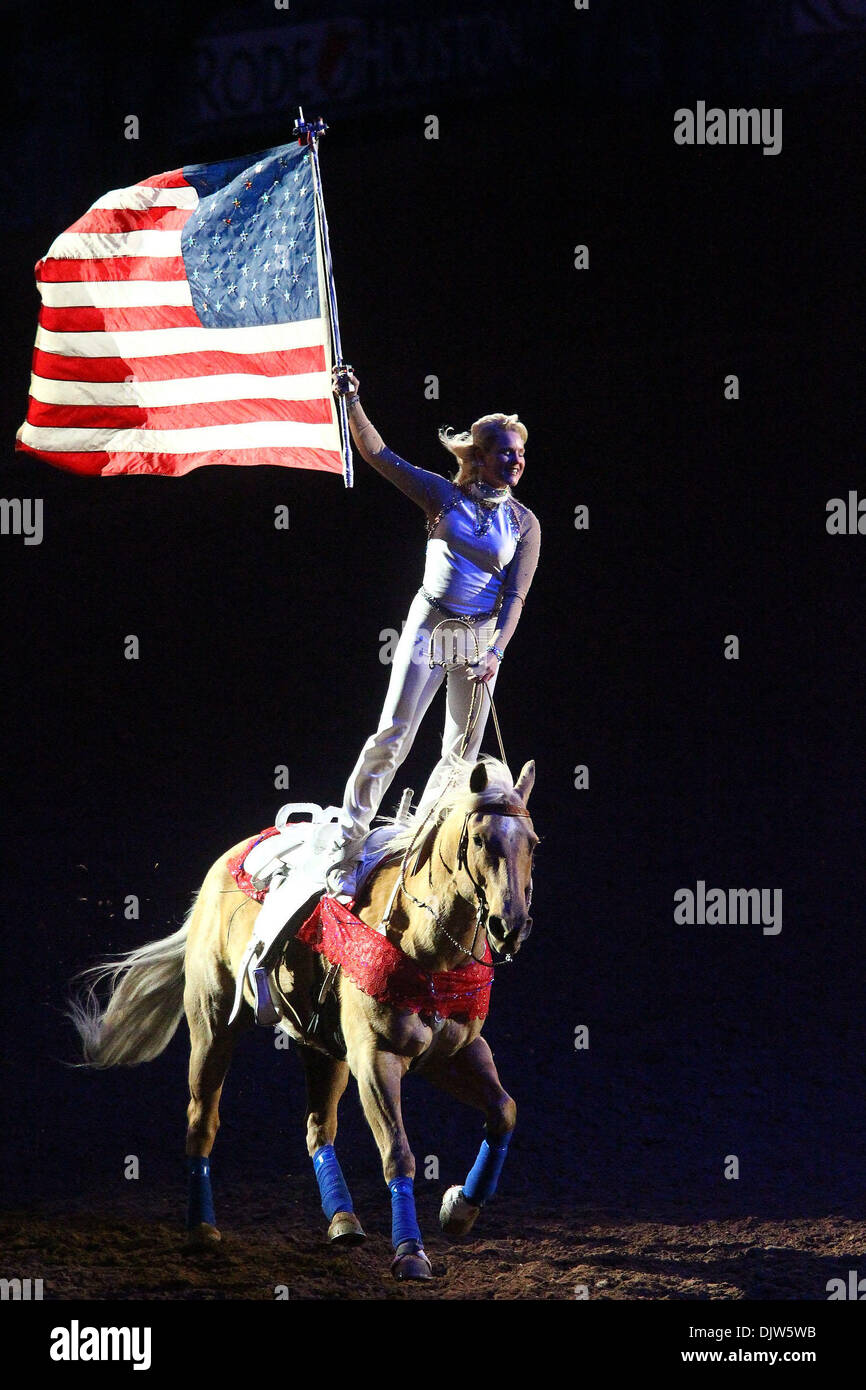 March 2 2010: A rider carries the American Flag during the National ...